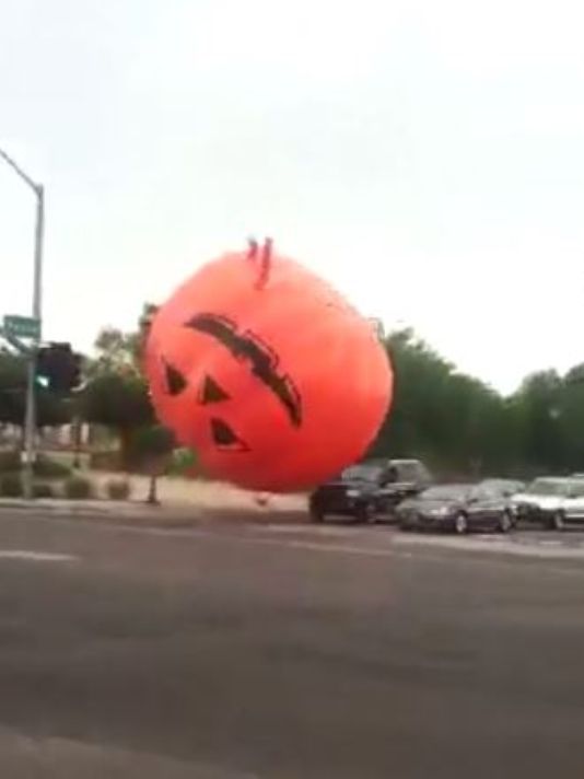 Storm gusts blow giant, inflatable pumpkin through Peoria, Arizona ...